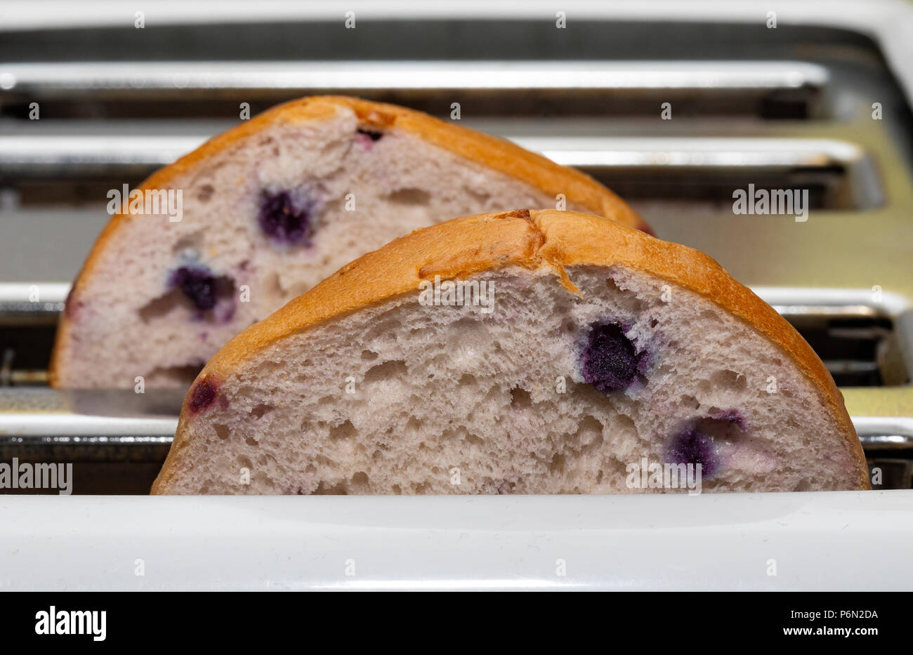 A sliced blueberry bagel ready for toasting Stock Photo - Alamy
