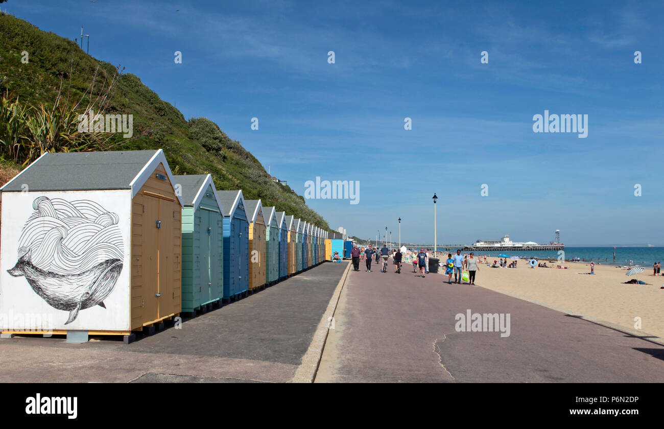 colourful beach huts on the promenade at bournemouth beach, Dorset, UK ...