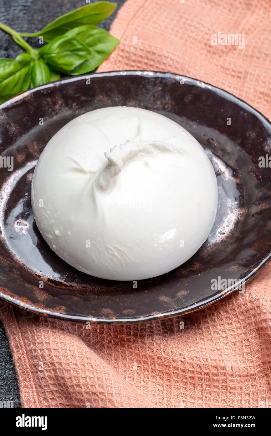 Fresh soft white burrata, ball buttery cheese, made from a mix of ...