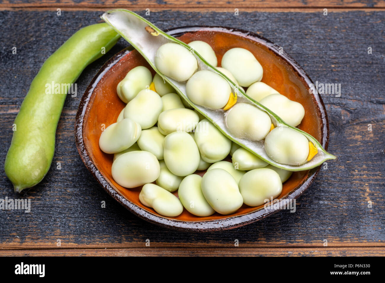 New harvest of healthy vegetables, green fresh raw big broad beans ...