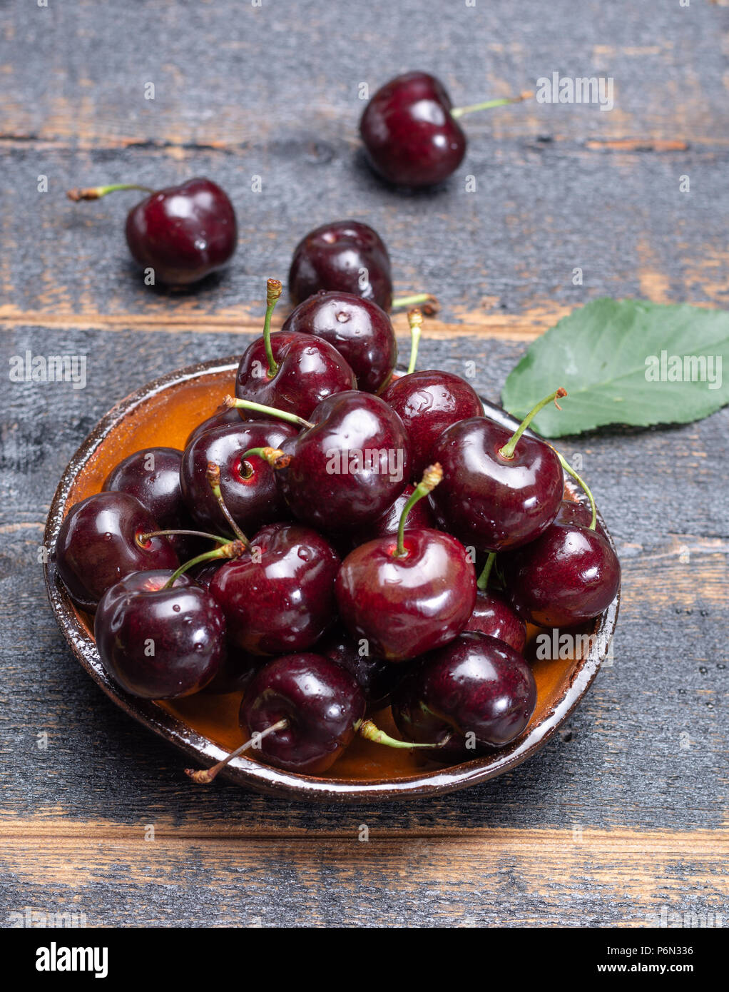 Giant fresh ripe black cherries, new harvest, ready to eat close up ...
