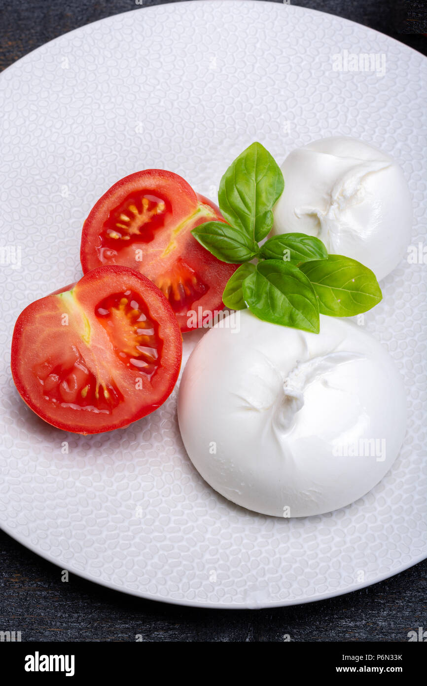 Fresh soft white burrata, ball buttery cheese, made from a mix of ...