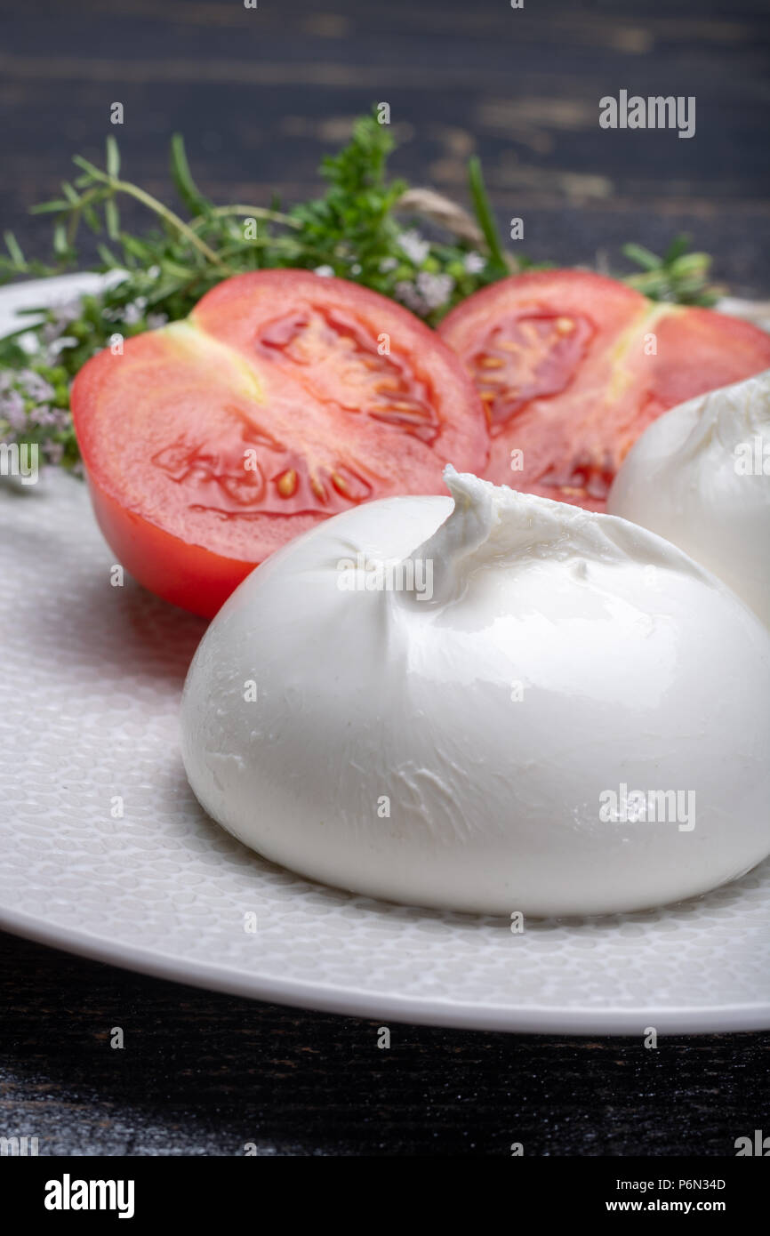 Fresh soft white burrata, ball buttery cheese, made from a mix of ...