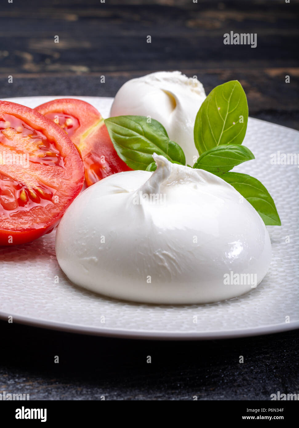 Fresh soft white burrata, ball buttery cheese, made from a mix of ...