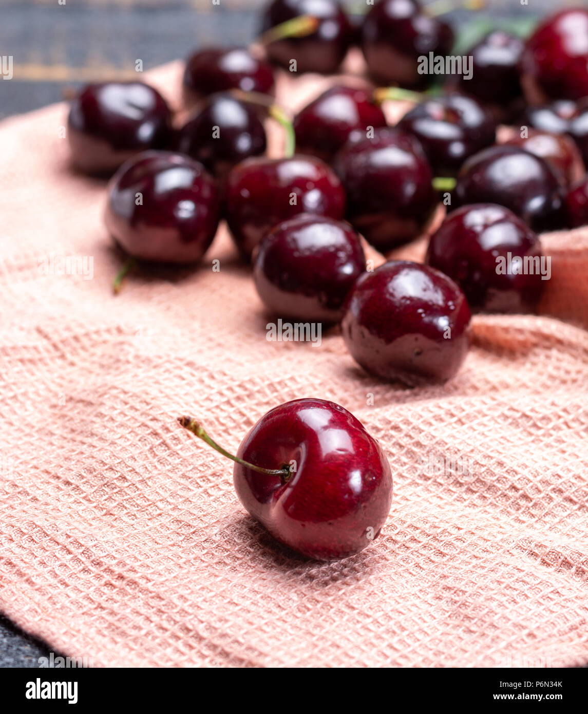 Giant fresh ripe black cherries, new harvest, ready to eat close up ...