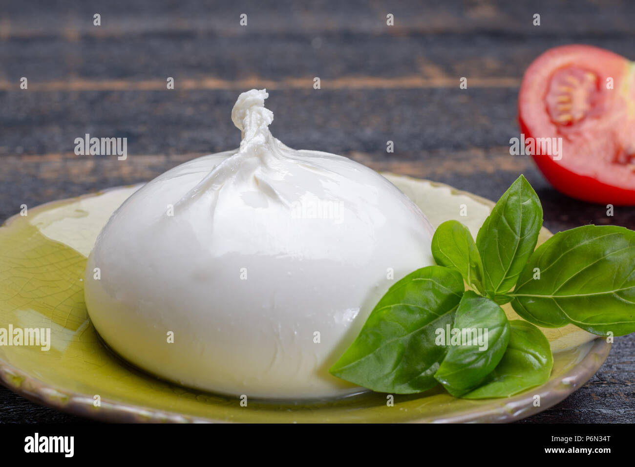 Fresh soft white burrata, ball buttery cheese, made from a mix of ...