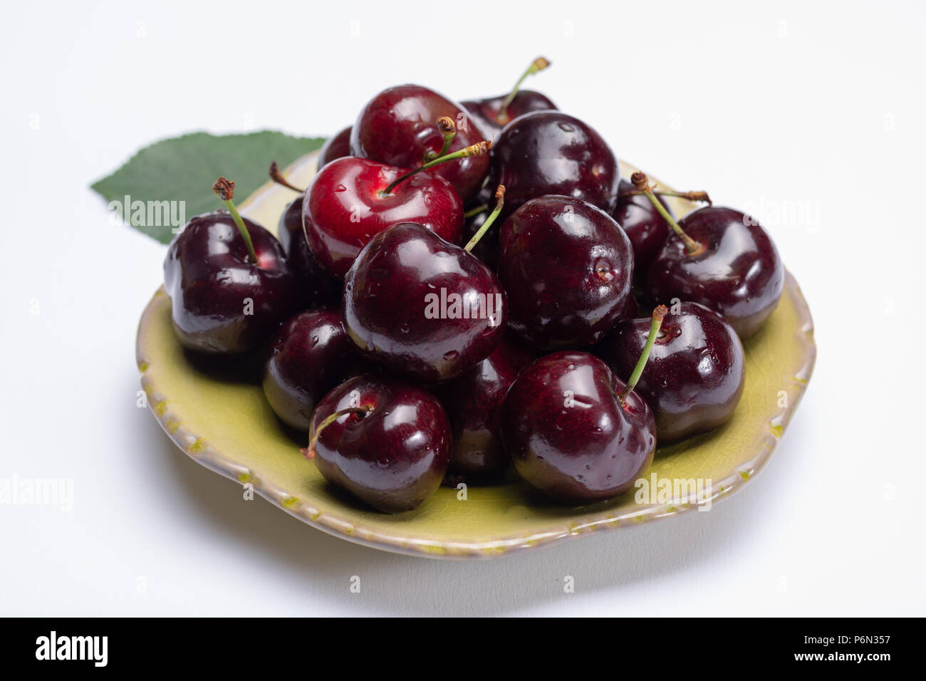 Giant fresh ripe black cherries, new harvest, ready to eat close up ...