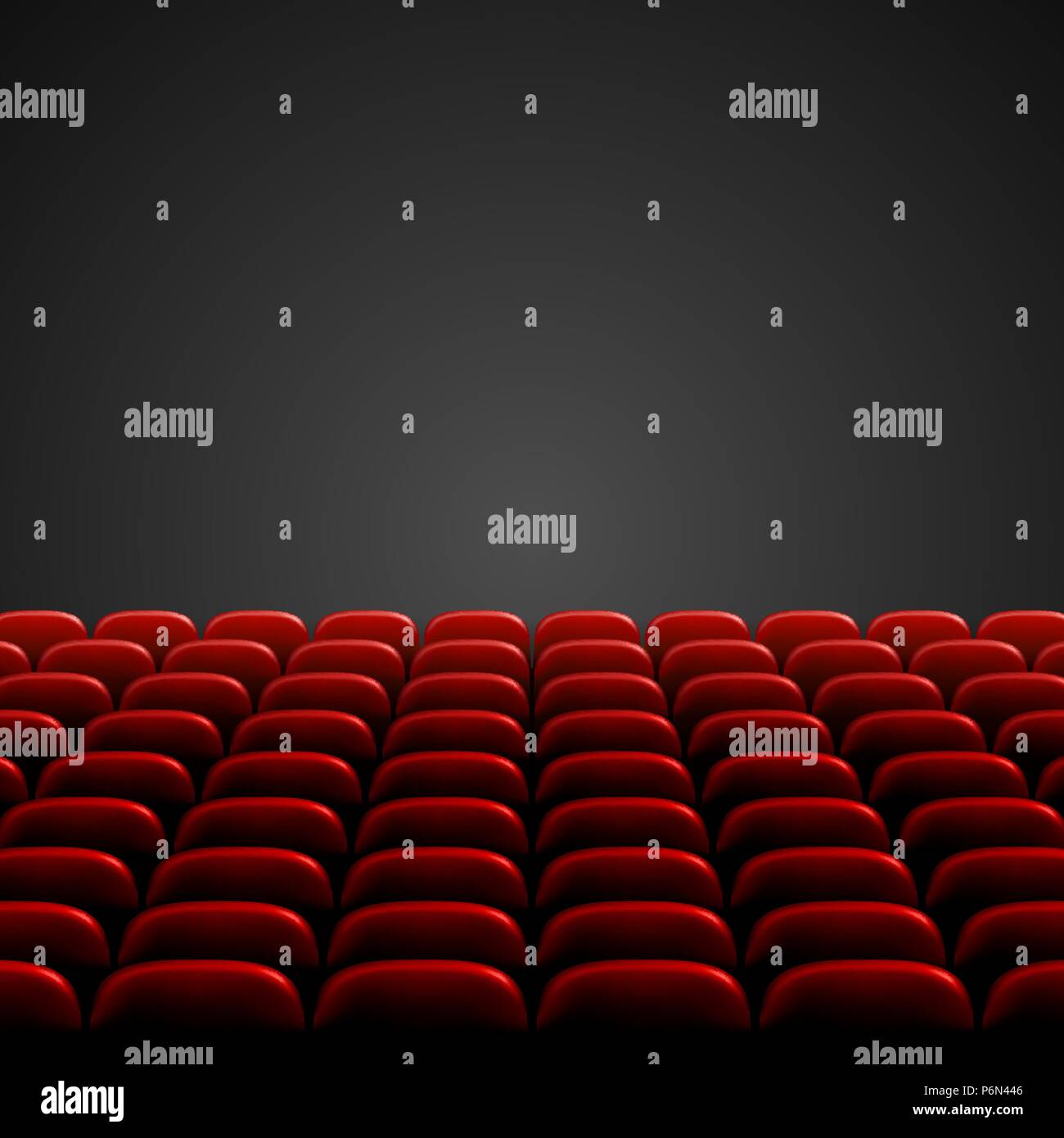 Rows of red cinema or theater seats in front of black blank screen. Wide empty movie theater ...