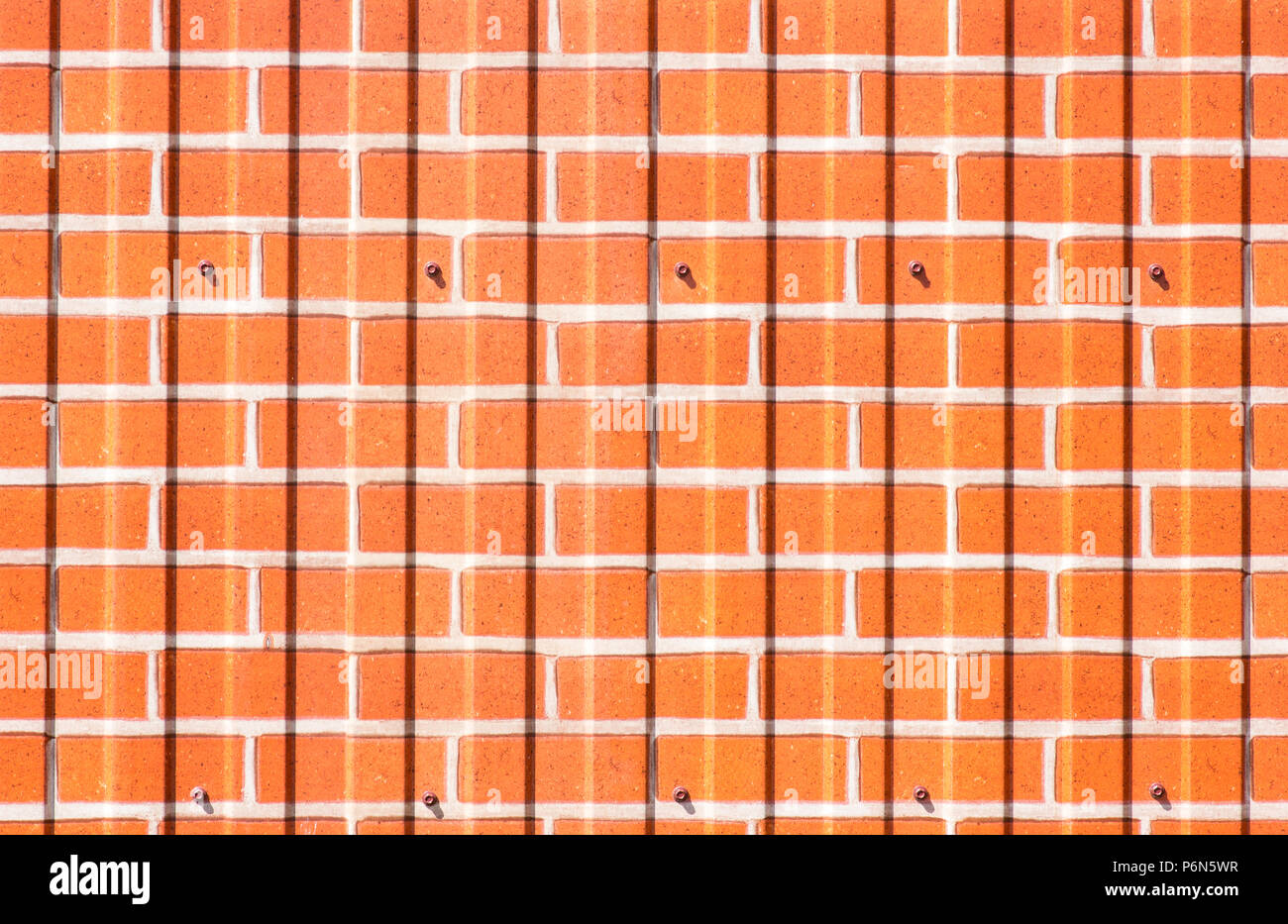 Wall of stylized red brick, modern cladding of buildings Stock Photo ...