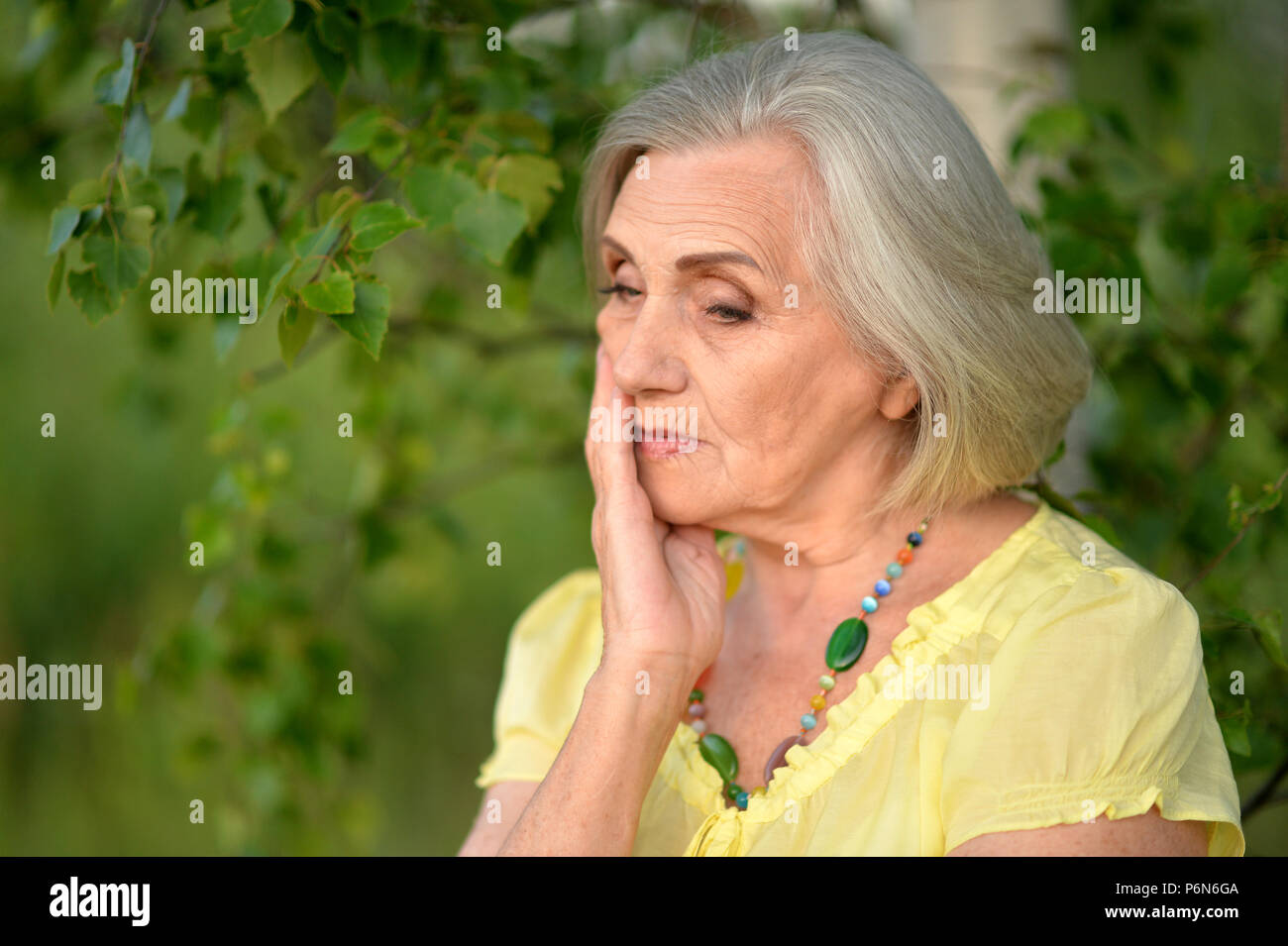 beautiful sad senior woman Stock Photo - Alamy