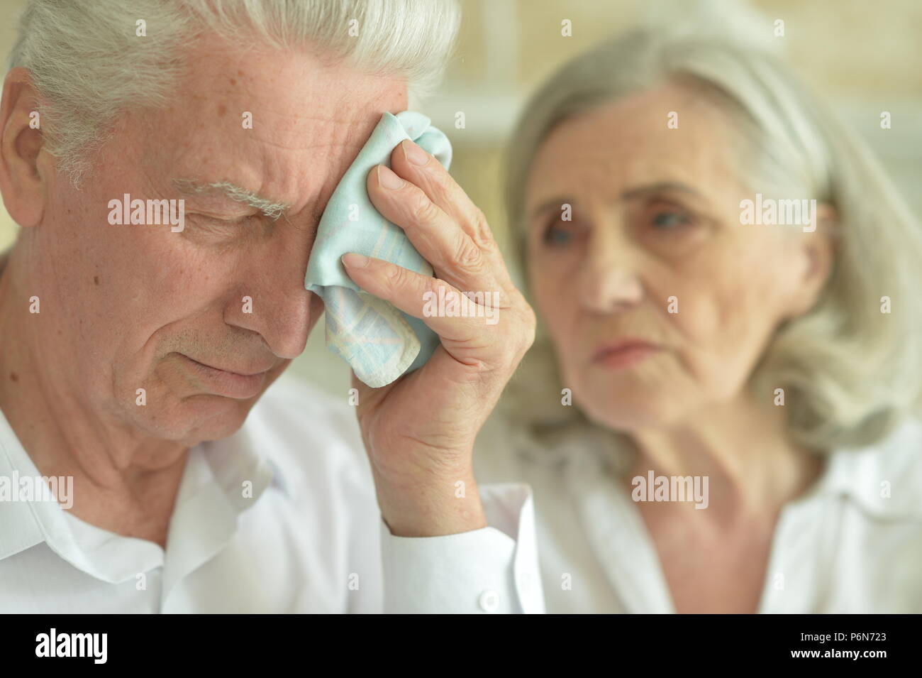 man holding hand on cheek Stock Photo - Alamy