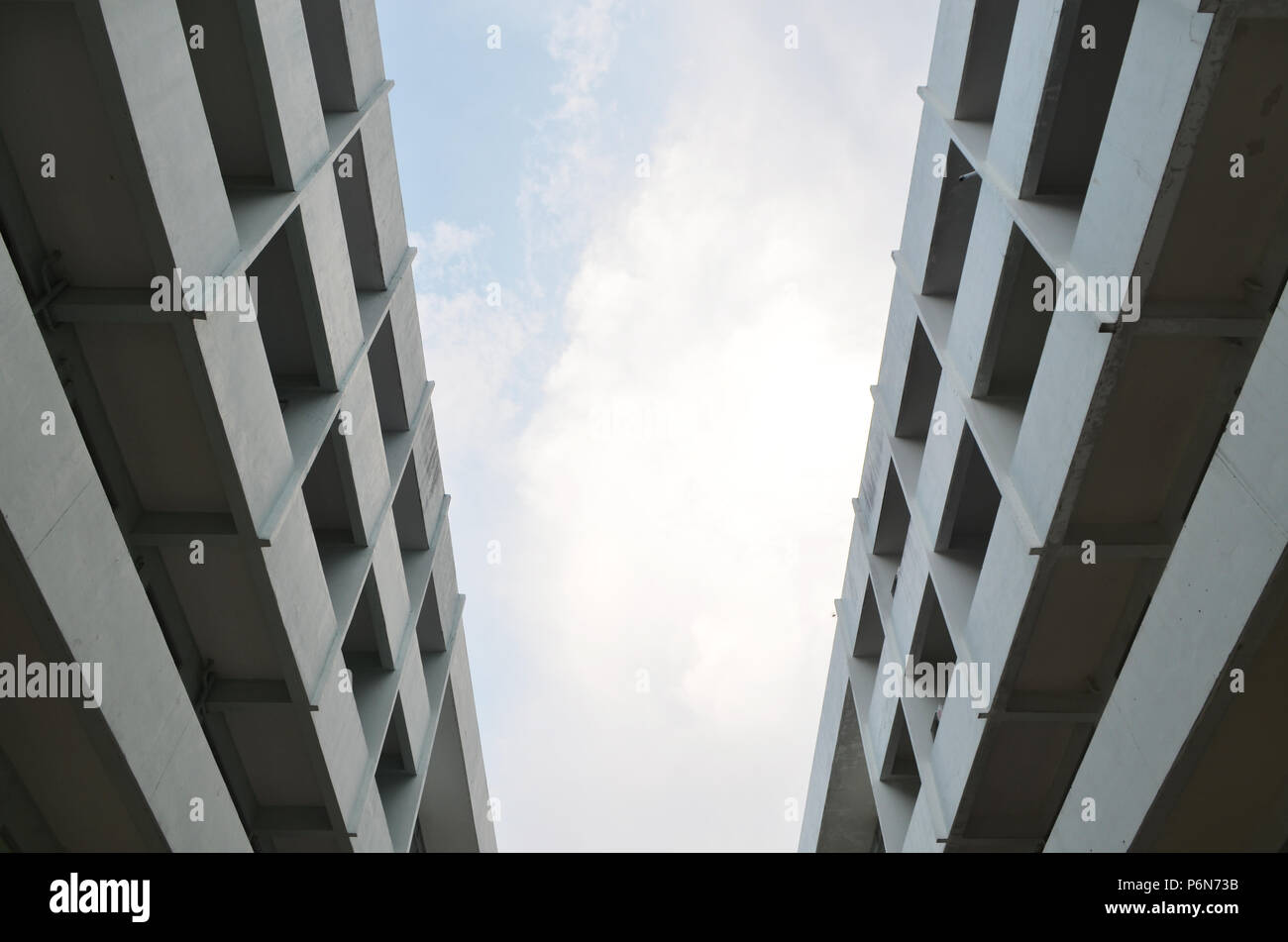 Low-angle view of a tall commercial building under construction against ...