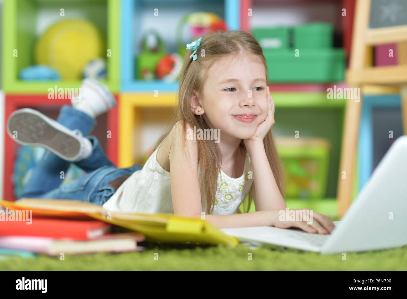 Cute schoolgirl doing homework Stock Photo - Alamy