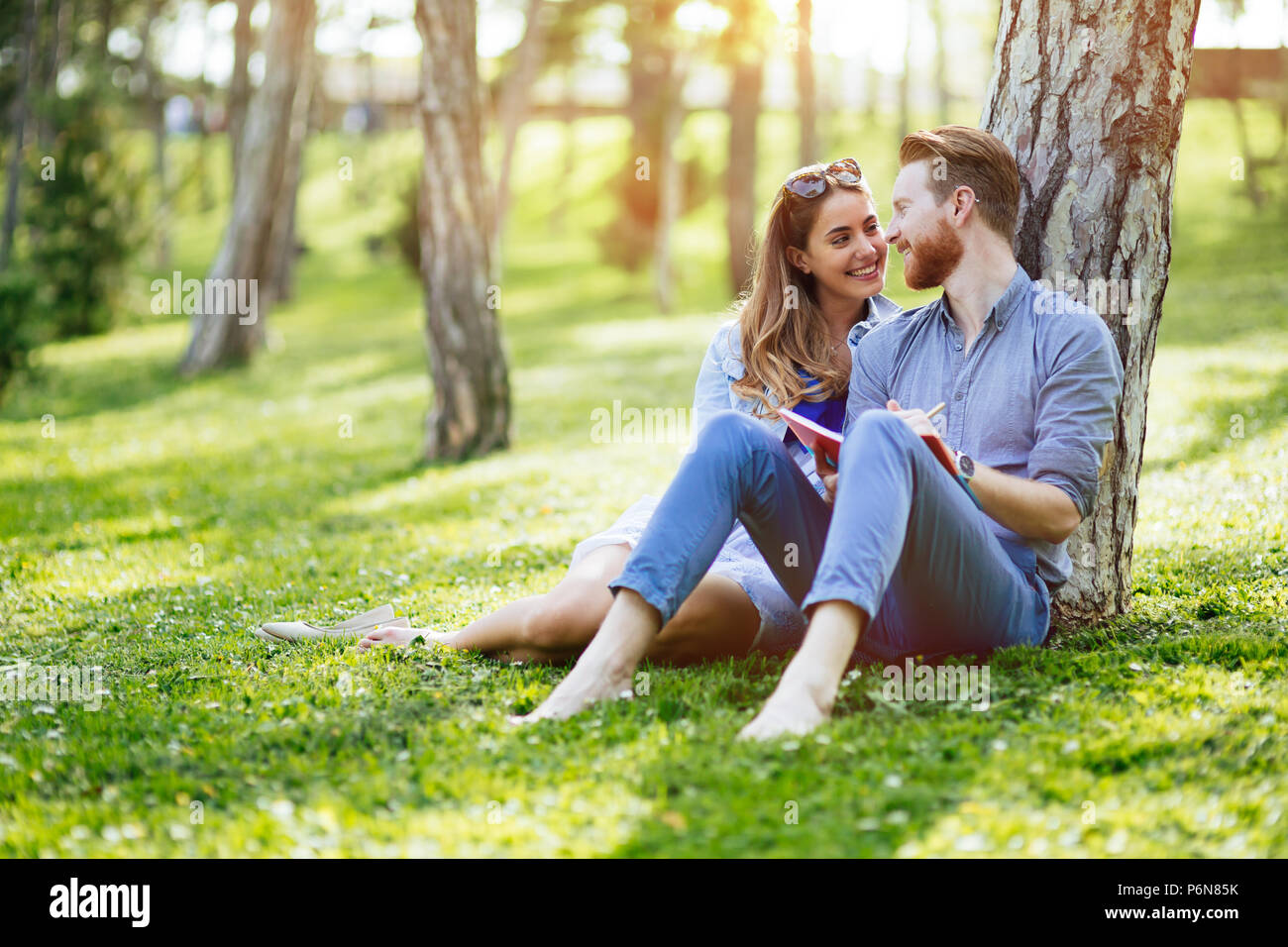 Cute uni students studying together Stock Photo - Alamy
