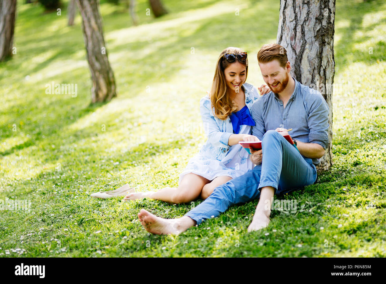 Beautiful couple studying together for exams Stock Photo - Alamy