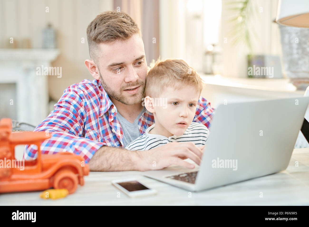 Father and Son Using Laptop Stock Photo - Alamy