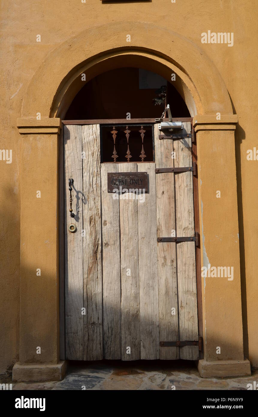 Italian style door, on ivy wall Stock Photo - Alamy
