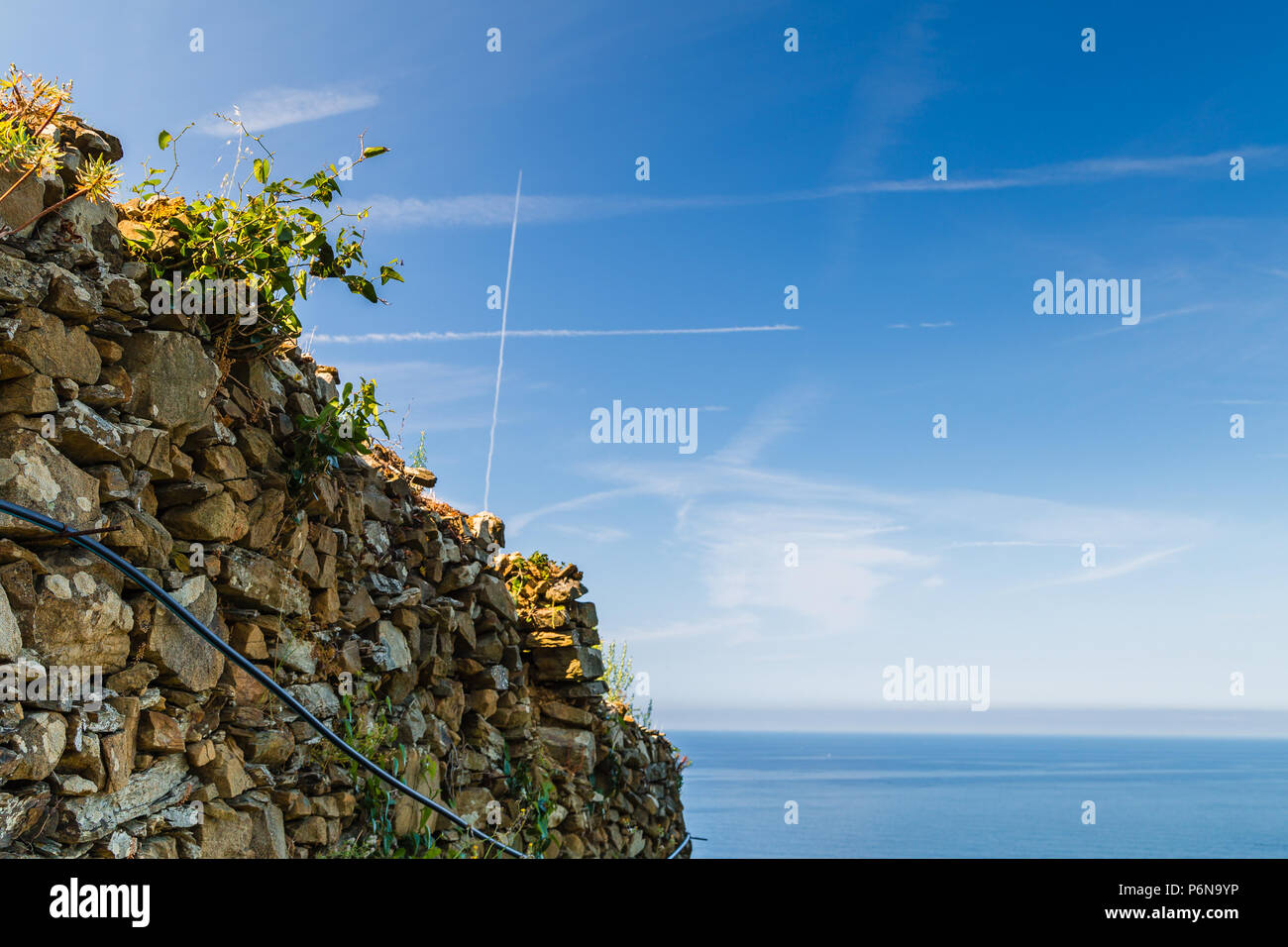Crossed plane trails in the sky Stock Photo - Alamy