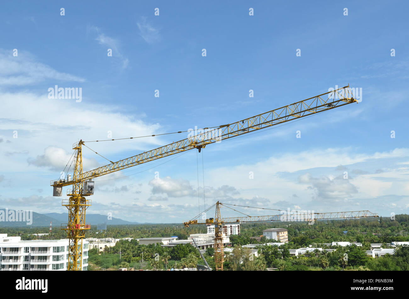 Crane and building working progress, construction site Stock Photo - Alamy