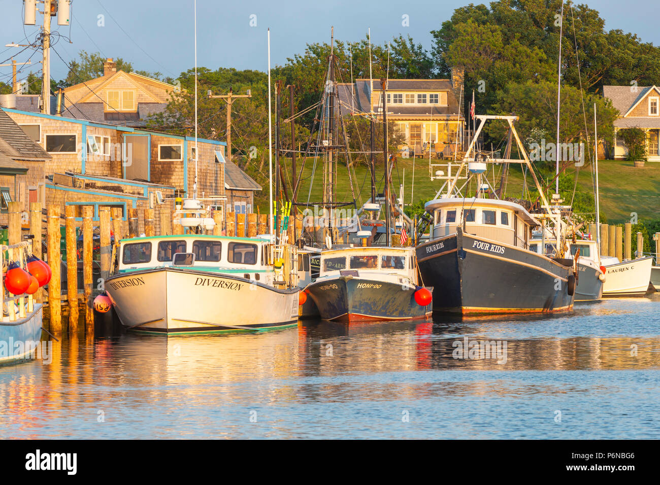 Commercial fishing boats docked in Menemsha Basin, in the fishing ...