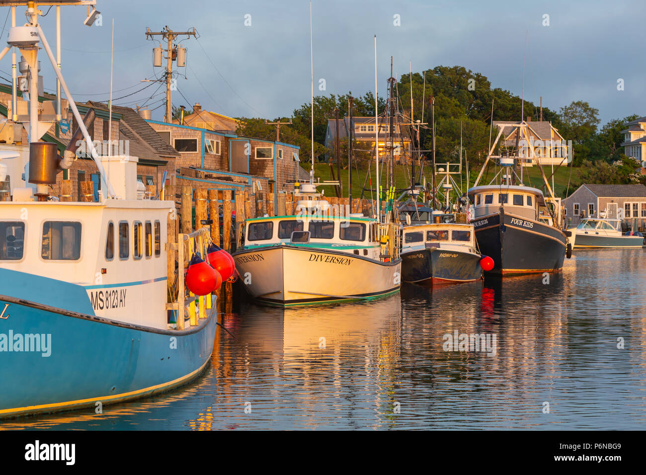 Commercial fishing boats docked in Menemsha Basin, in the fishing ...