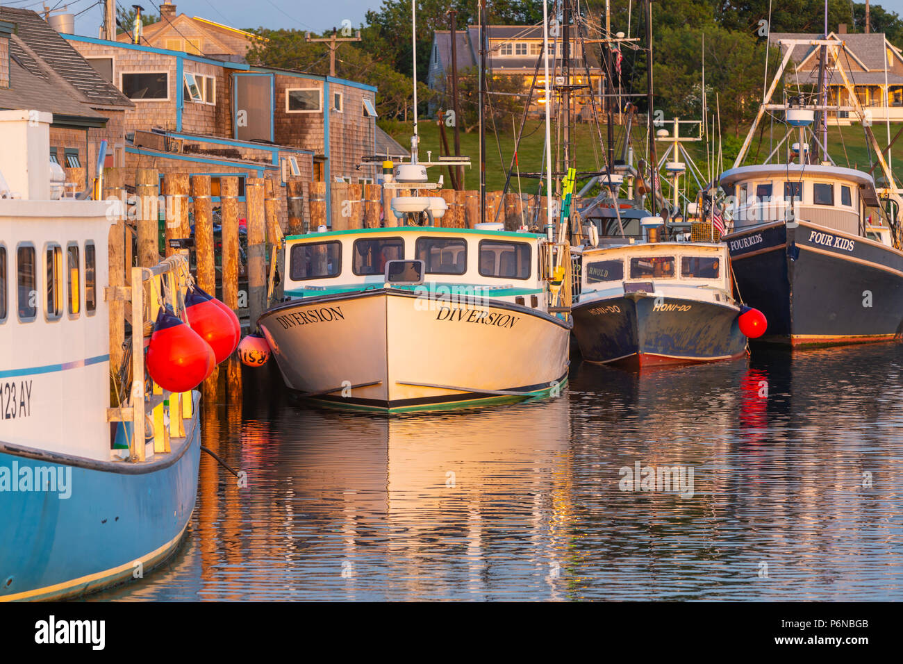 Commercial fishing boats docked in Menemsha Basin, in the fishing ...