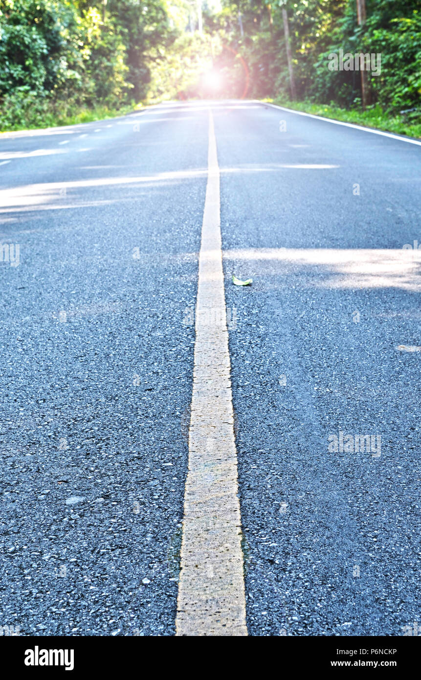 Asphalt road texture with yellow stripe Stock Photo - Alamy