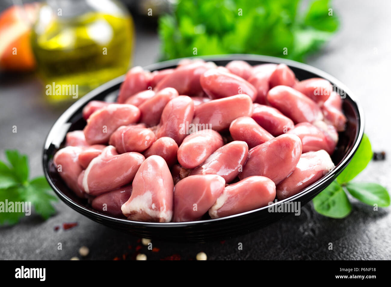 Raw chicken hearts. Fresh chicken hearts Stock Photo - Alamy