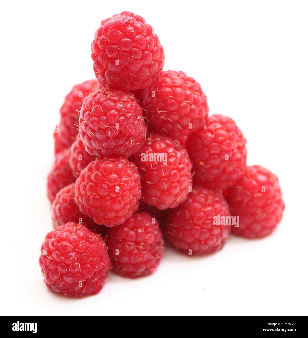 The pyramid of ripe raspberry over white background Stock Photo - Alamy