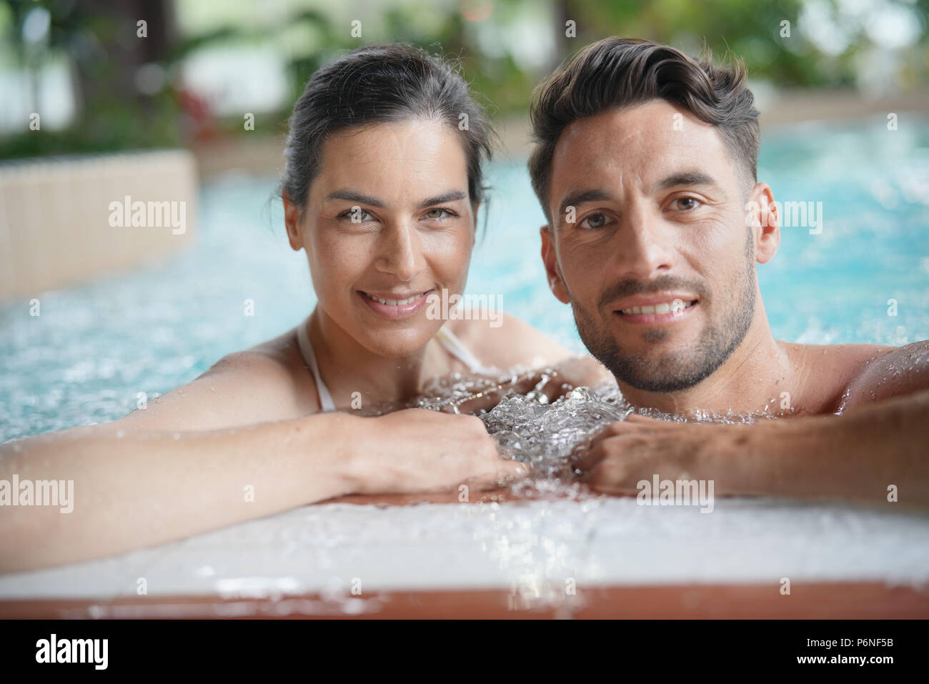 Couple relaxing in spa resort pool Stock Photo - Alamy