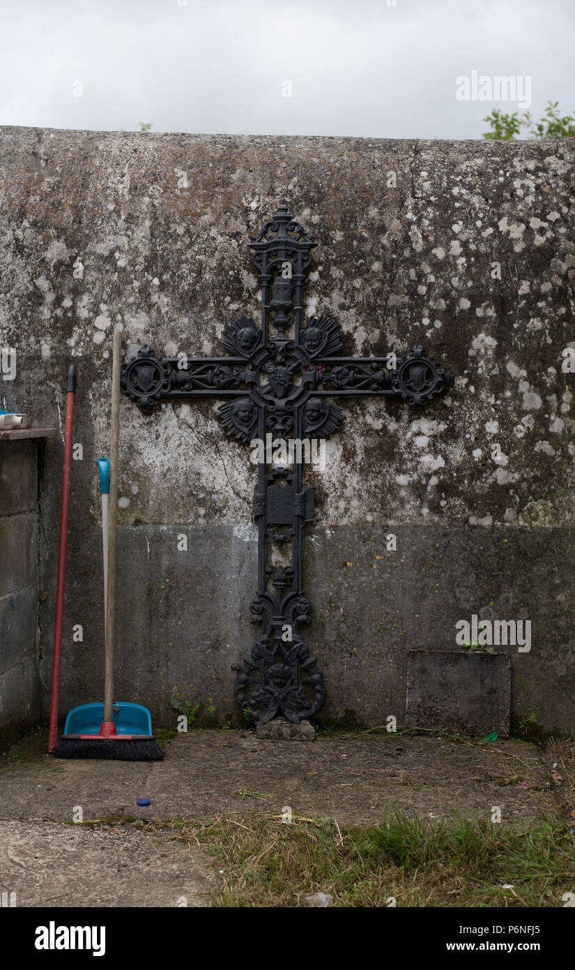 Broom and cross on a wall Stock Photo - Alamy