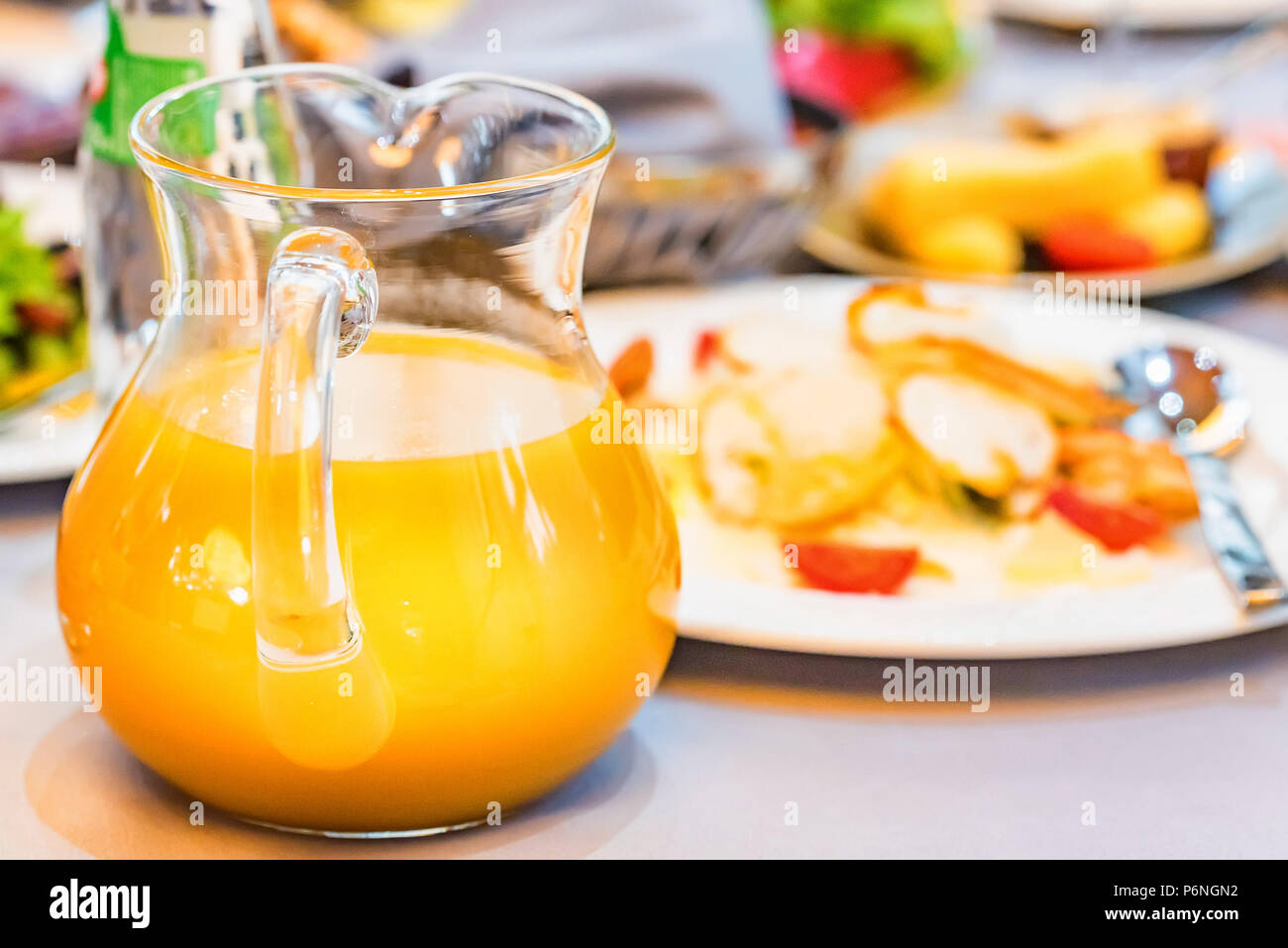 Orange juice in jug on restaurant table Stock Photo - Alamy