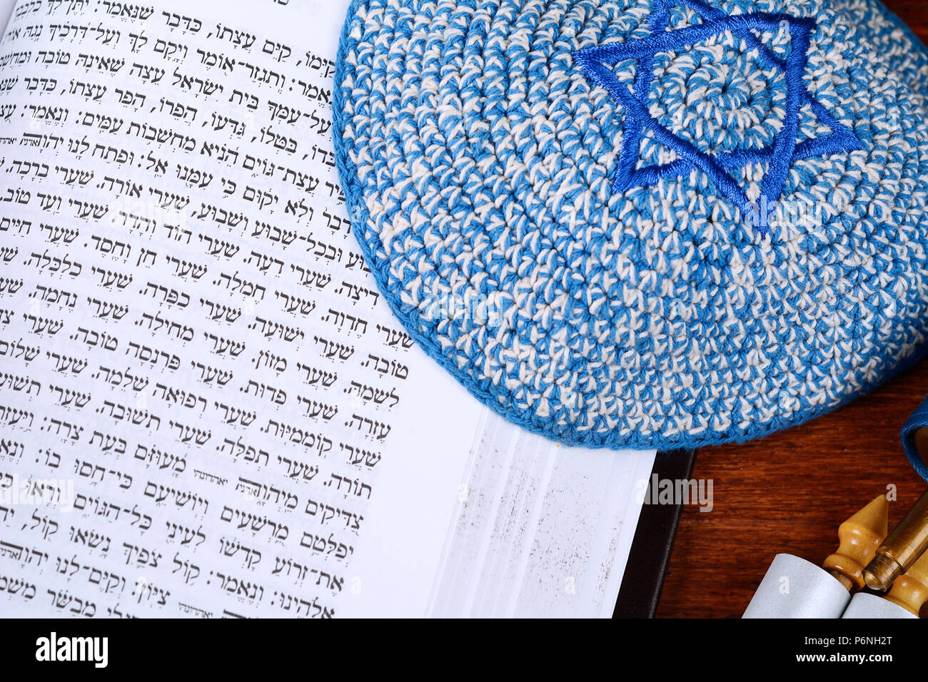 Torah with kippah on wooden background. Jewish religion concept Stock ...