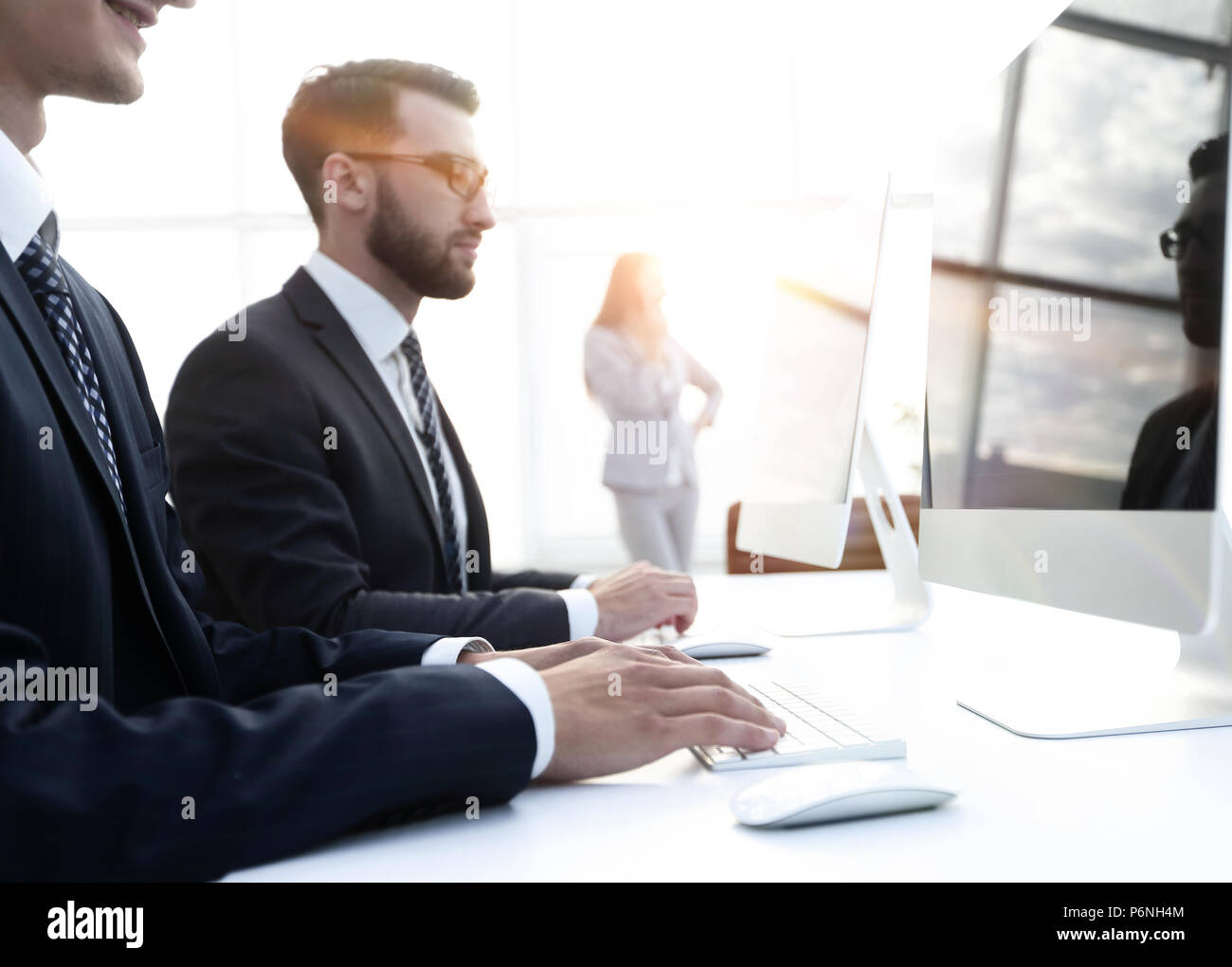 employees working on computers Stock Photo - Alamy