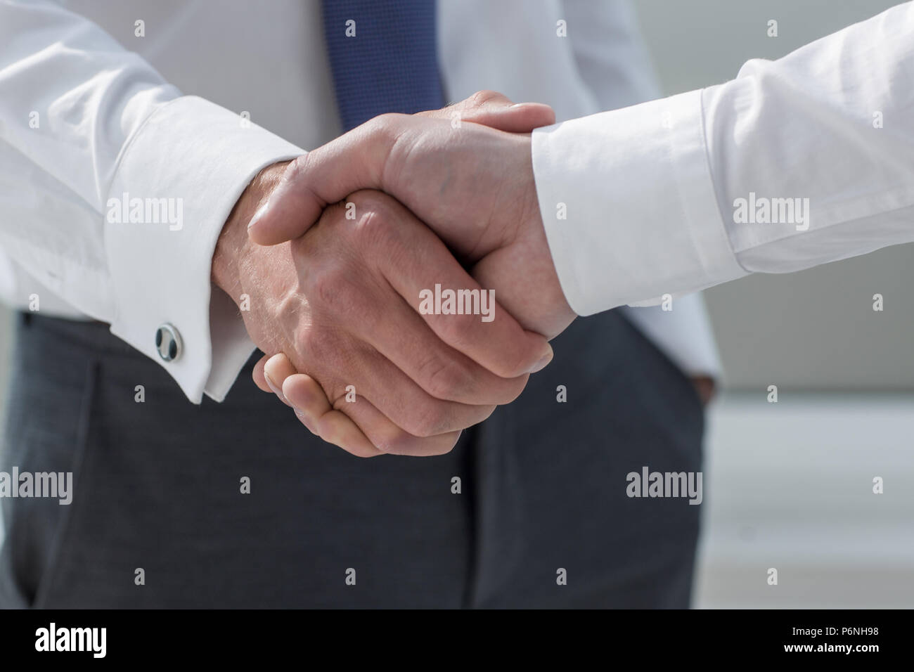 close up.business handshake of two men Stock Photo - Alamy