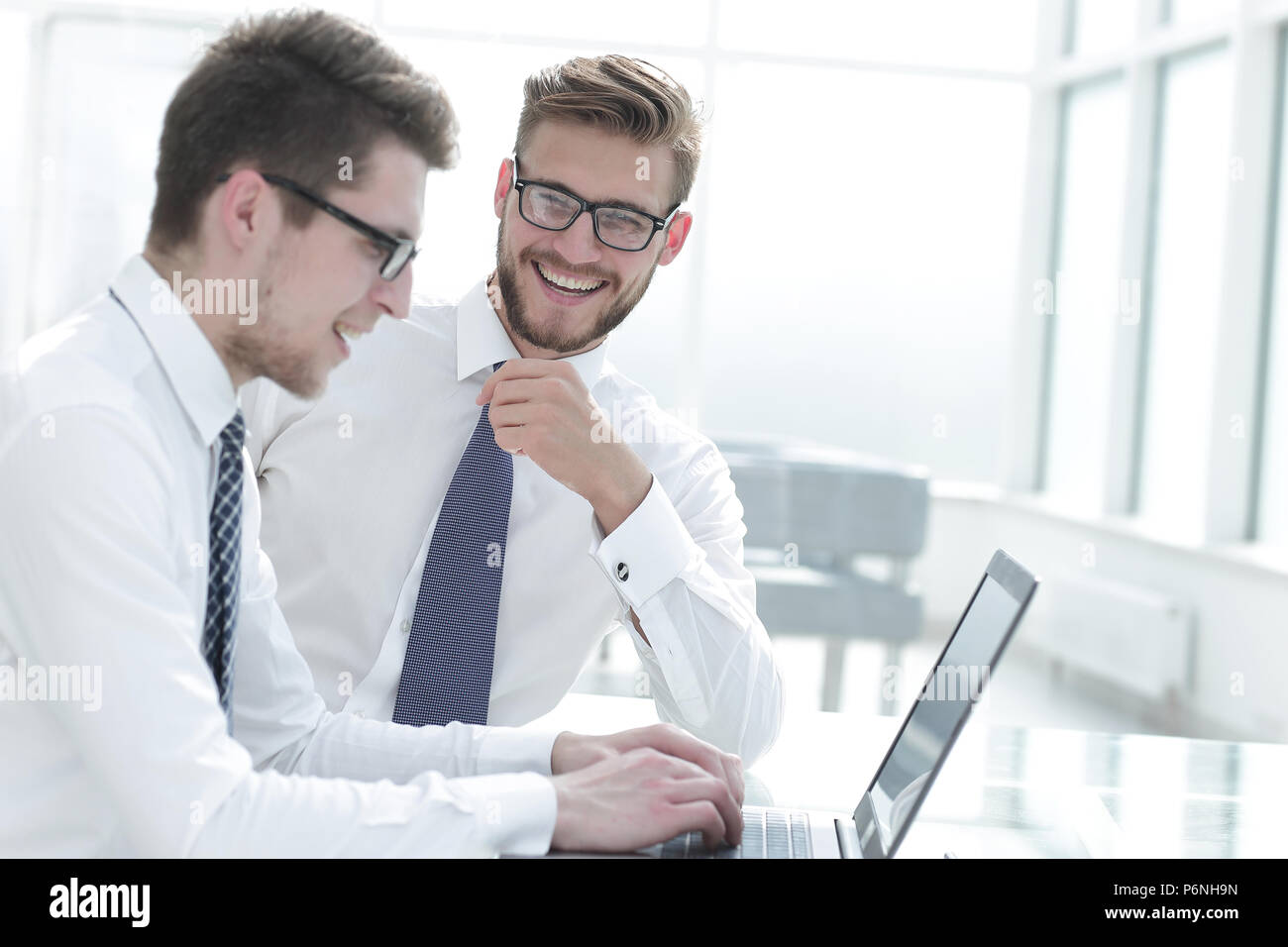 close up.employees working with a laptop in the office Stock Photo - Alamy