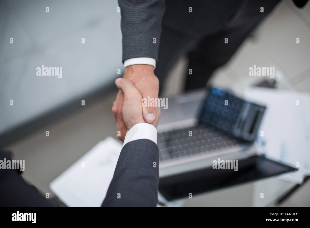 close up.handshake trading partners over the desktop Stock Photo - Alamy