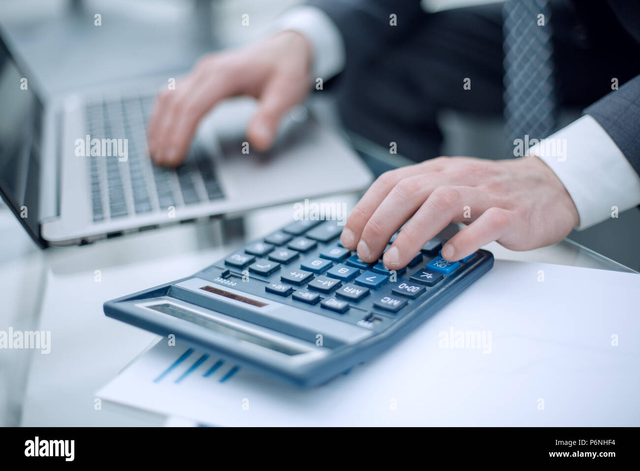 close up.businessman makes calculations on the calculator Stock Photo ...