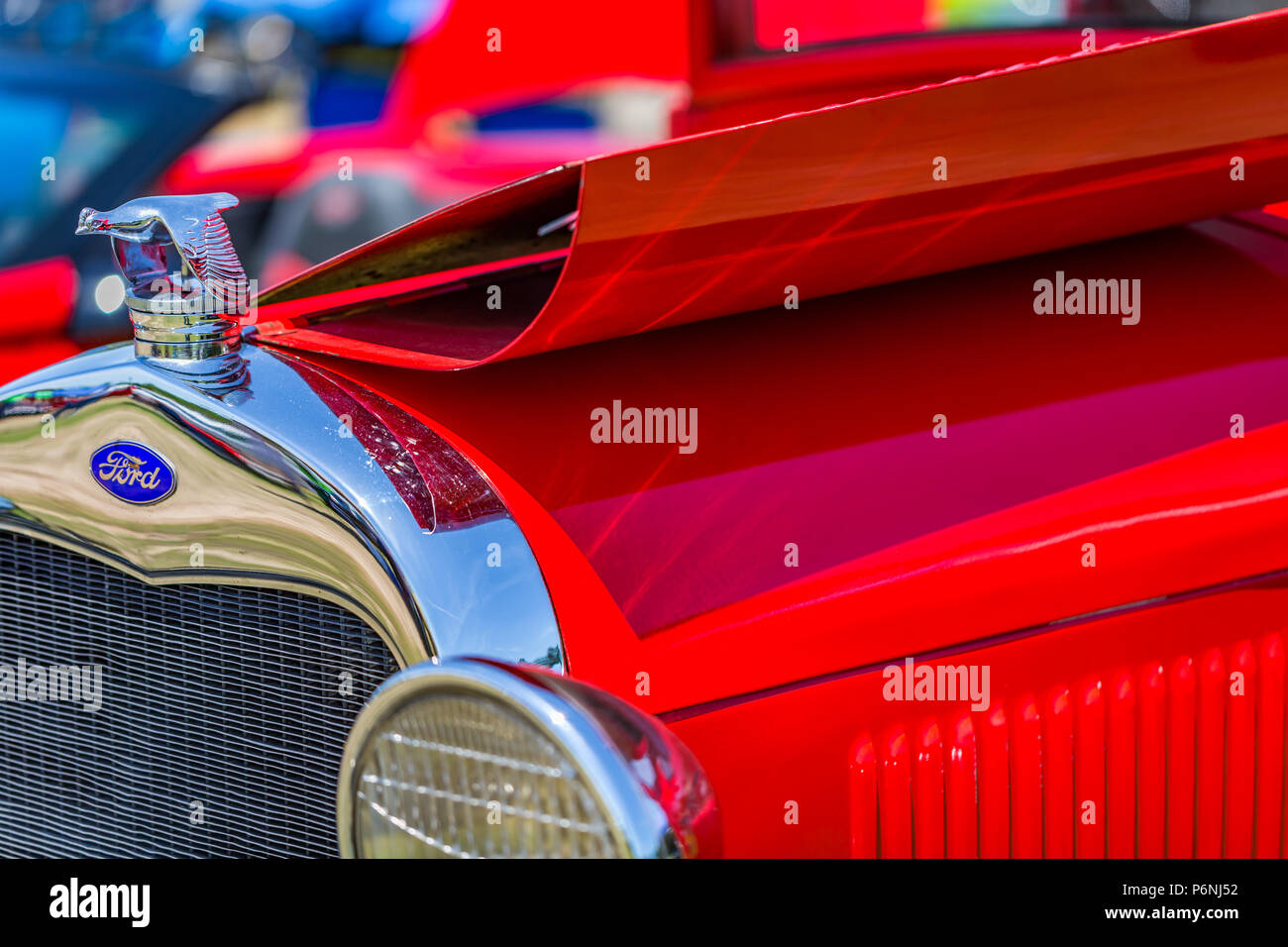 Shallow depth of field closeup of the hood ornament and grille on a ...