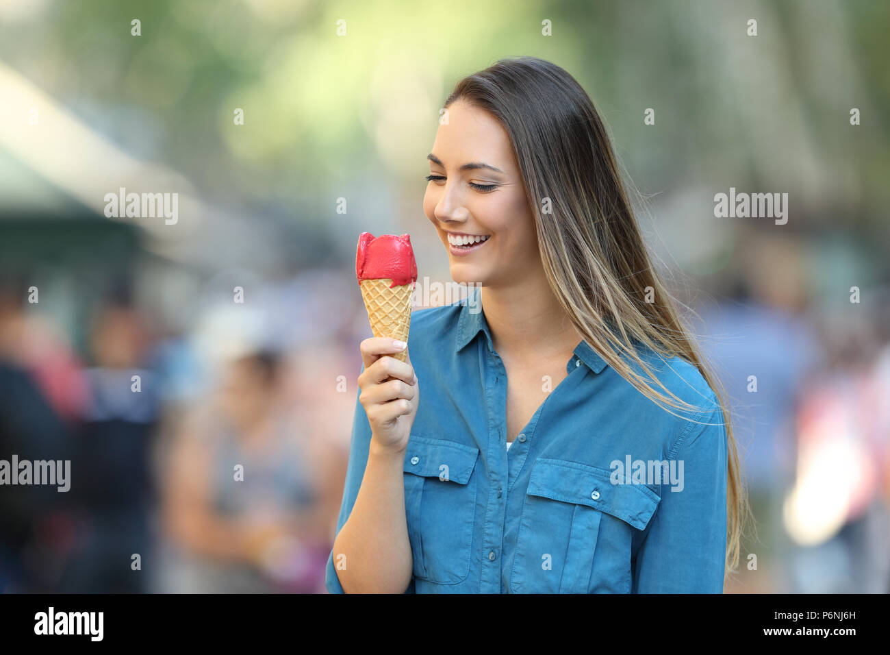 Girl walking eating ice cream on hi-res stock photography and images ...