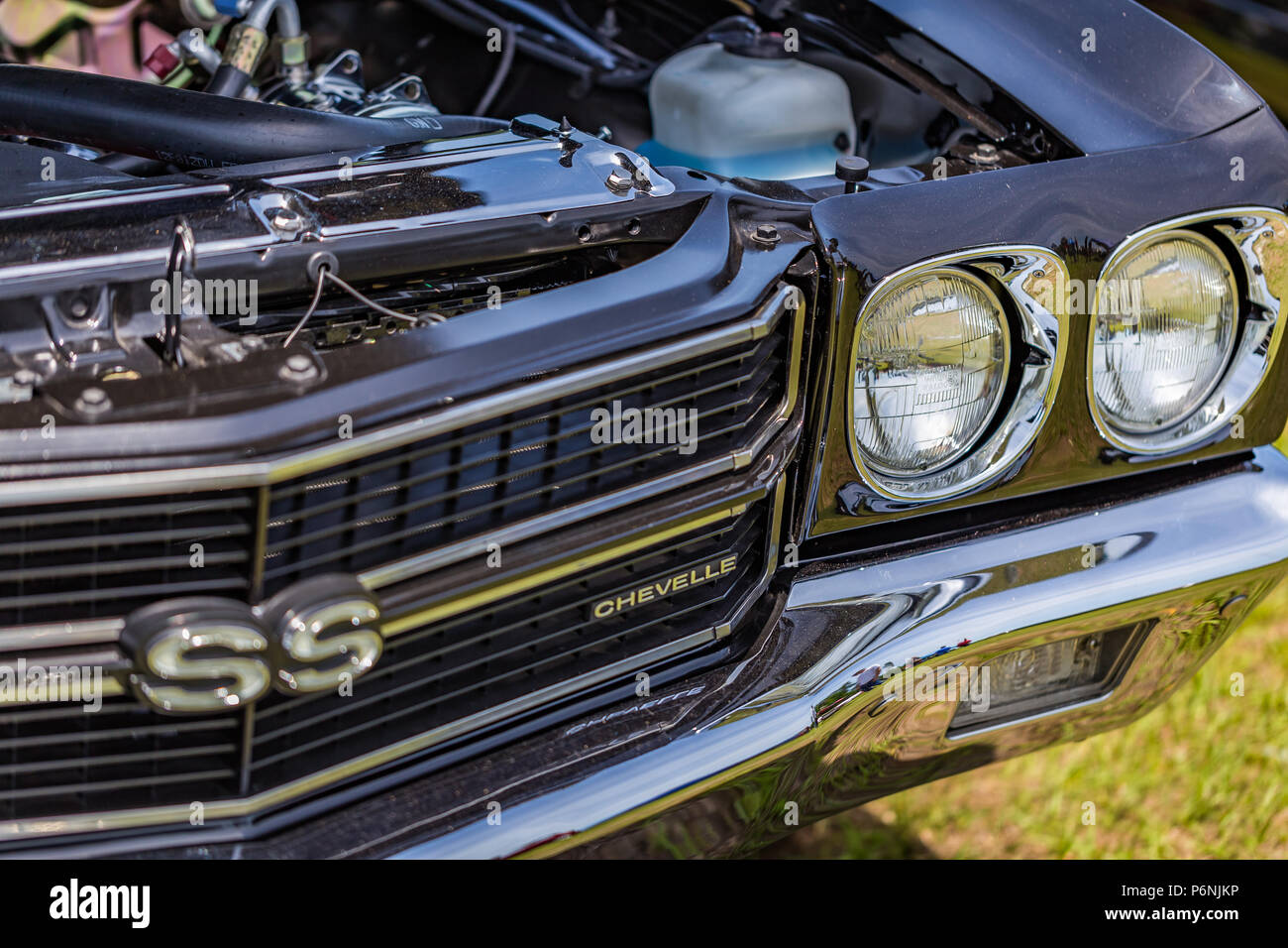 shallow depth of field closeup of the headlight assembly and front end ...
