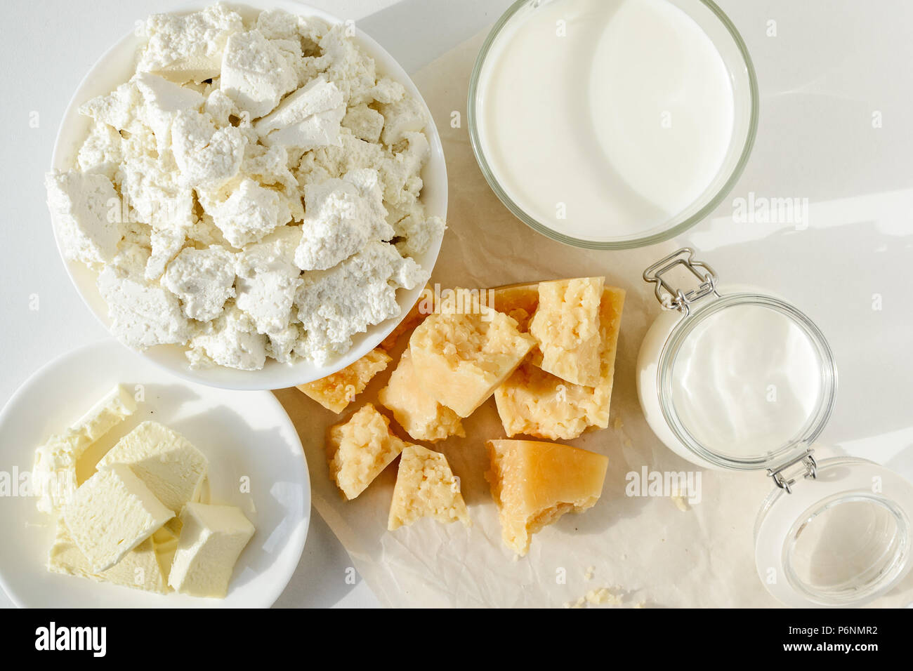 different kinds of fresh dairy products on white background top view ...