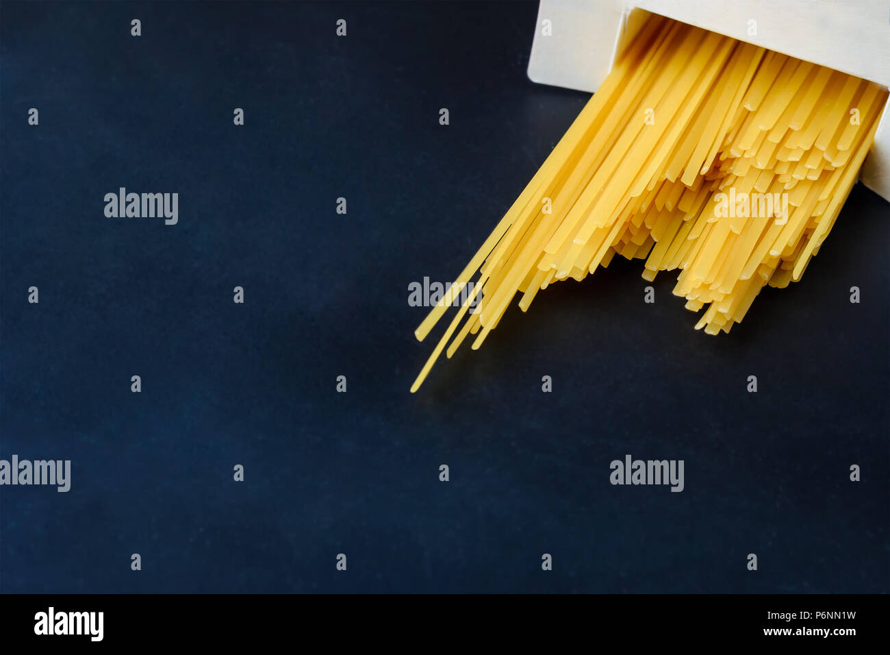 Yellow long spaghetti in container hi-res stock photography and images ...