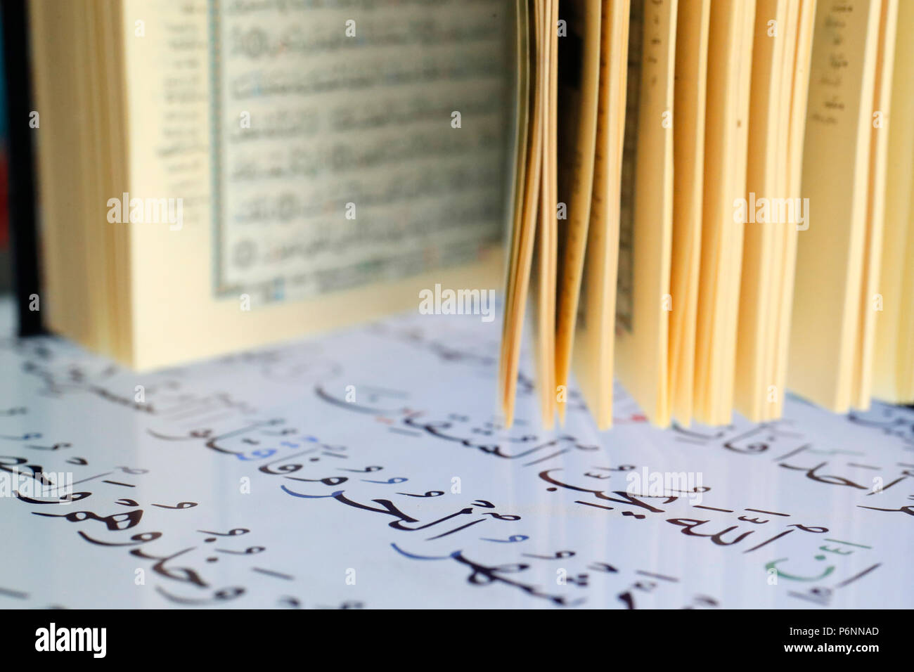 The Quran on paper and tablet Stock Photo - Alamy