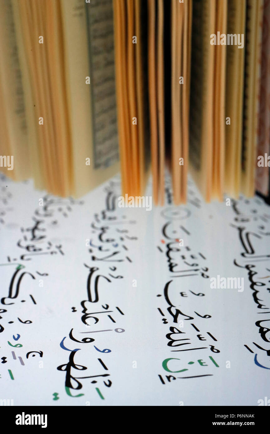The Quran on paper and tablet Stock Photo - Alamy