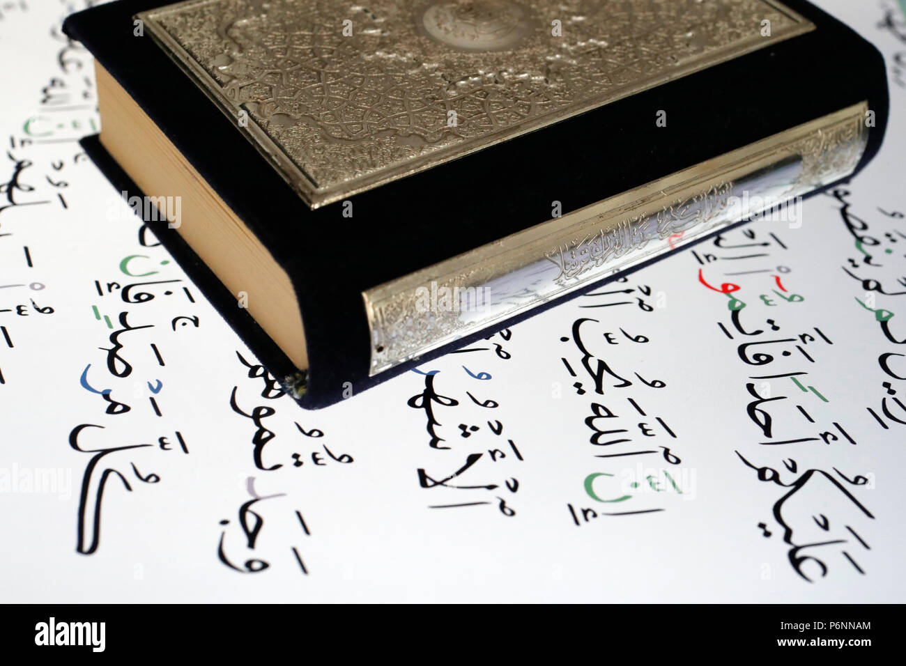 The Quran on paper and tablet Stock Photo - Alamy