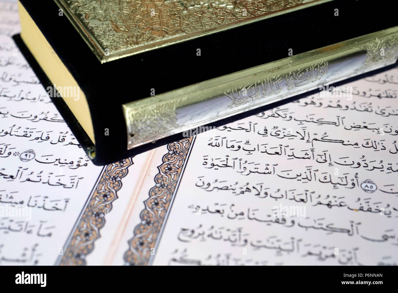 The Quran on paper and tablet Stock Photo - Alamy