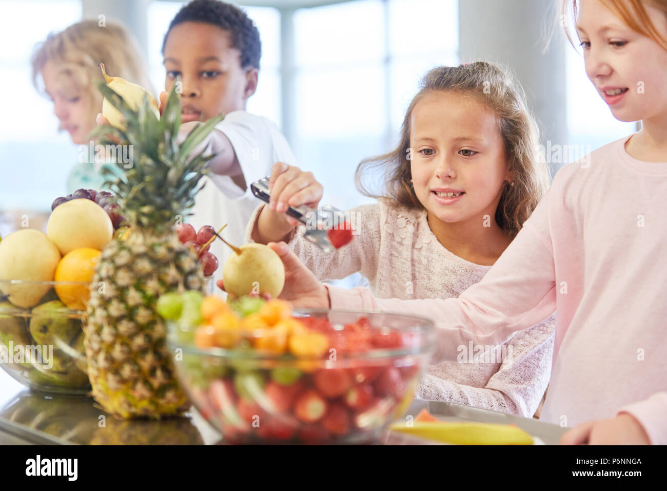 Children at the canteen cafeteria in kindergarten or elementary school ...