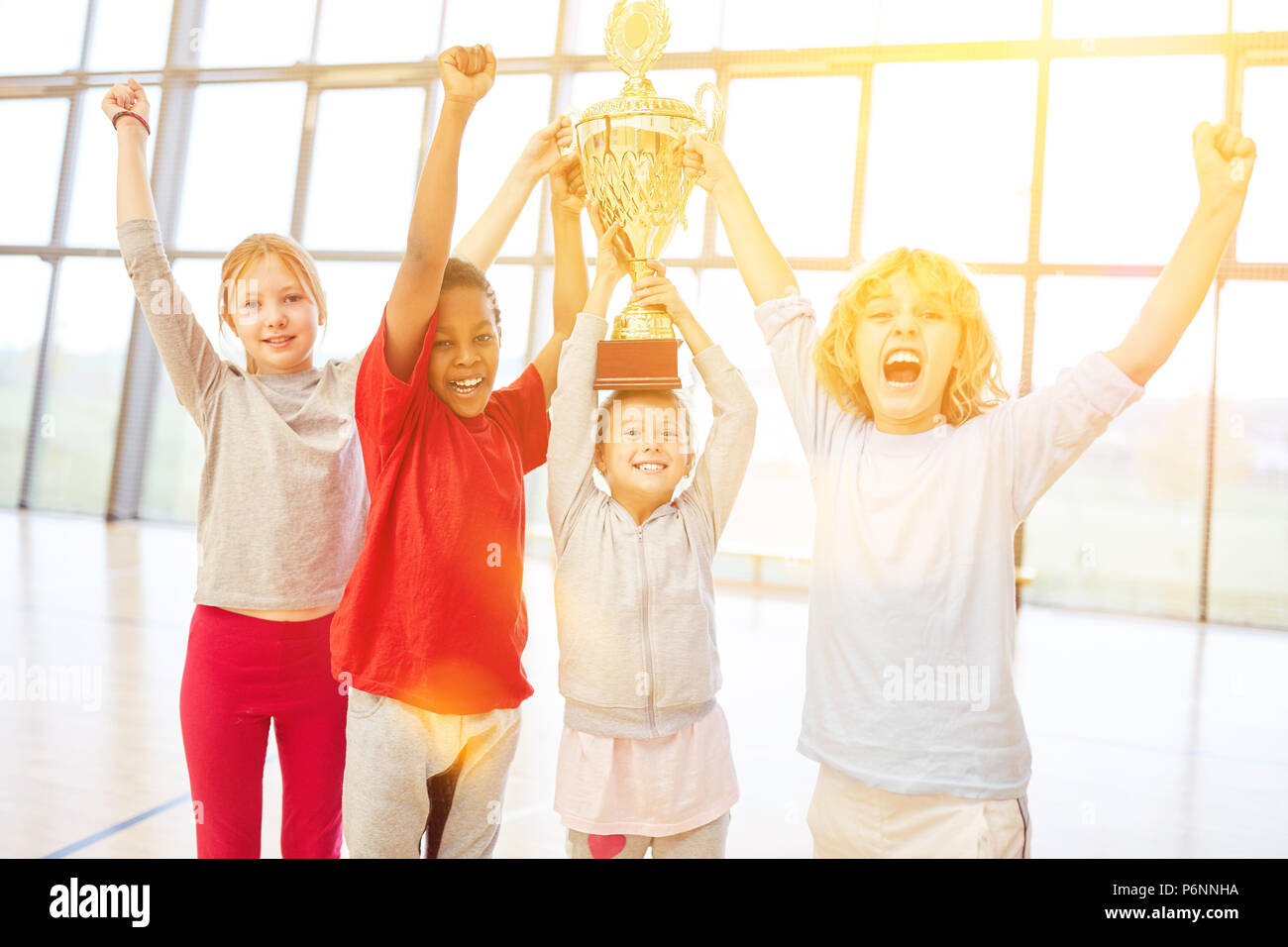 Children team winners hi-res stock photography and images - Alamy