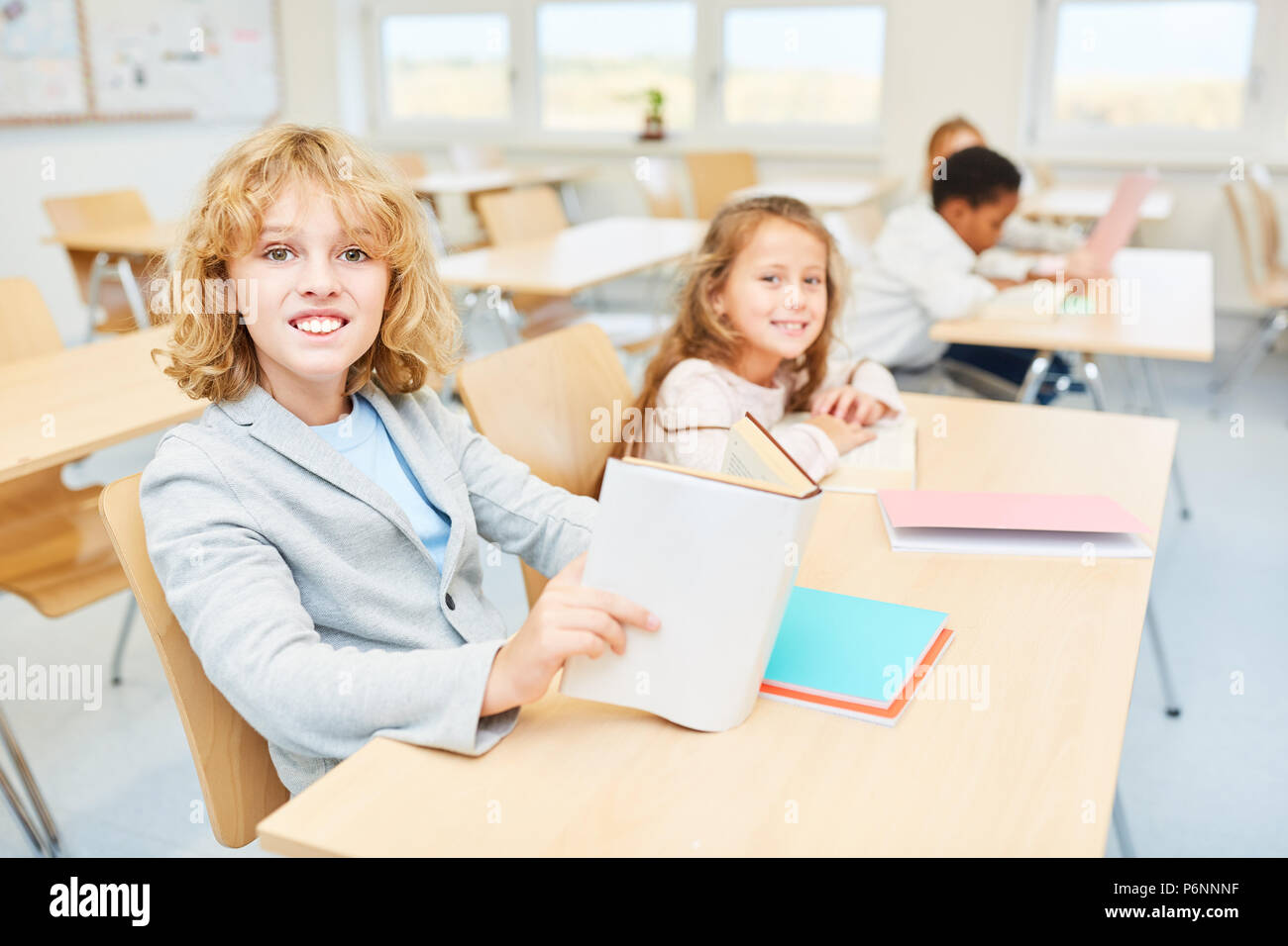 Happy primary school pupils hi-res stock photography and images - Alamy